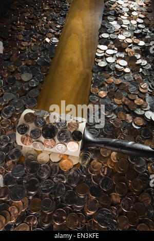 Lint roller with coins Stock Photo - Alamy
