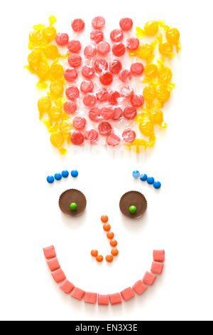a studio shot of a smiley face made out of strawberries isolated on a ...
