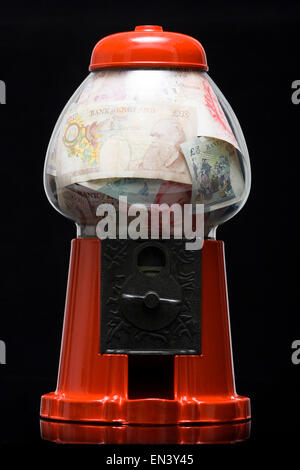 gumball machine full of money Stock Photo - Alamy