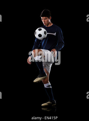Soccer player juggling ball Stock Photo - Alamy