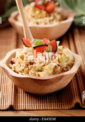 A bowl of rice on a wooden table Stock Photo - Alamy