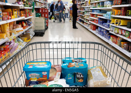 Tesco supermarket retail business interior with display stands flagged ...