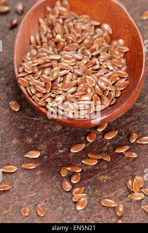 Flax seeds in a timber spoon, closeup shot Stock Photo - Alamy