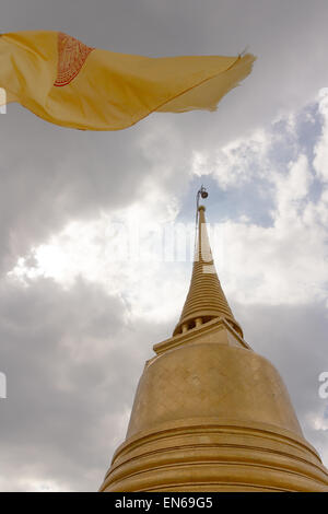 Golden Pagoda with dhama flag Stock Photo - Alamy