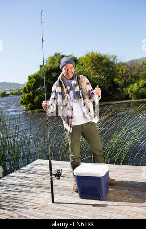 man holding a fish Stock Photo - Alamy
