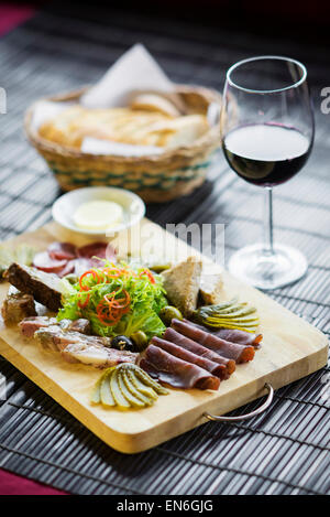 Mixed french traditional gourmet cured meats and pate starters platter ...