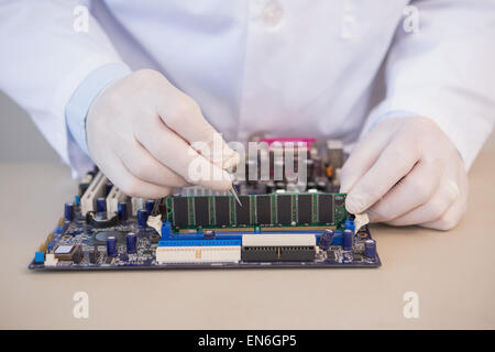 Engineer working on broken cpu Stock Photo - Alamy