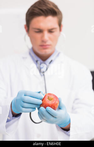 Scientist listening apple with stethoscope Stock Photo - Alamy