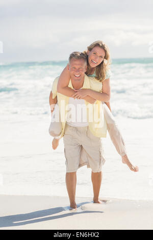 pretty mature couple having fun in the bed while eating breakfast Stock ...