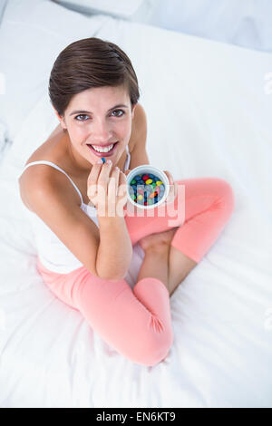 Beautiful young woman eating sweet watermelon in park Stock Photo - Alamy