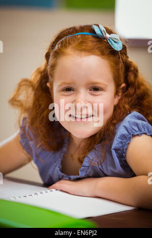 Pupil working hard at desk Stock Photo - Alamy