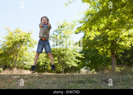 Cute little boy jumping Stock Photo - Alamy