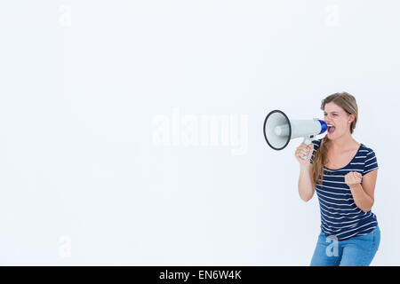 Young woman yelling to loudspeaker Stock Photo - Alamy