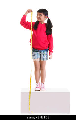 Girl measuring height Stock Photo - Alamy