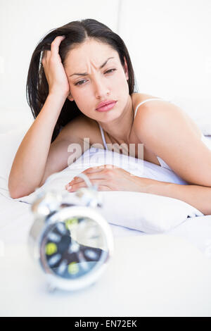 Pretty brunette waking up on bed Stock Photo - Alamy
