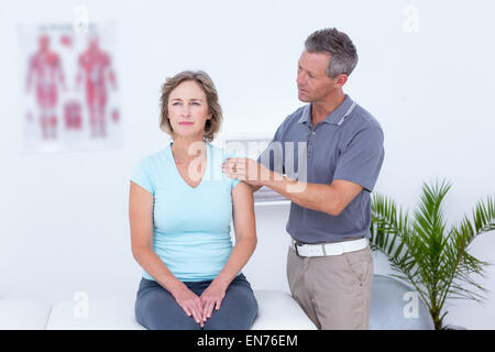 Doctor examining his patient back Stock Photo - Alamy