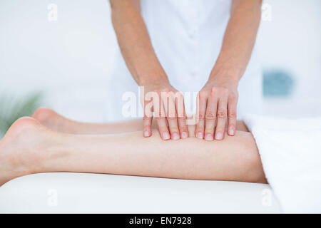 Physiotherapist doing leg massage to her patient Stock Photo - Alamy