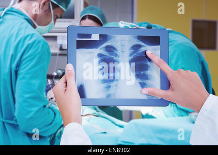 Tablet pc and doctor tools on white surface Stock Photo - Alamy