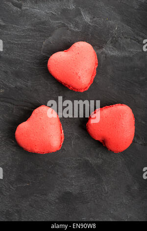 Pink heart homemade macaron cookies filled with raspberry jam on ...