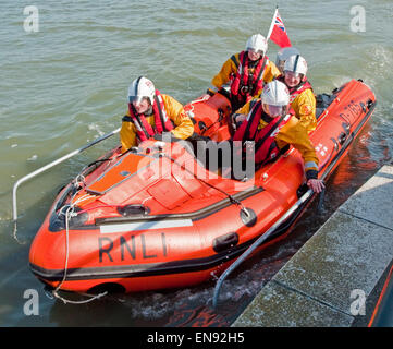 RNLI Lifeboat Inshore RIB launching off Criccieth Beach North Wales UK ...