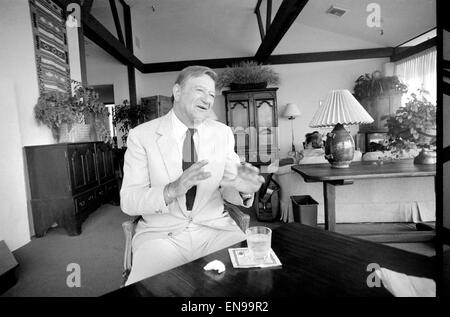 John Wayne who recently starred in 'Brannigan' at home in Texas playing ...