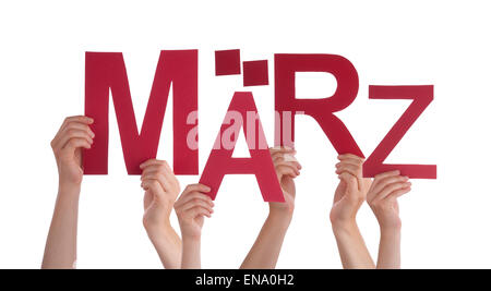 People Holding German Word Maerz Means March Blue Sky Stock Photo - Alamy