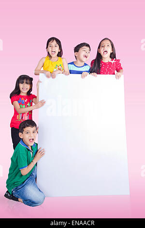 indian Kids groups Friends Showing Message Board Stock Photo - Alamy