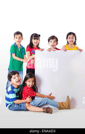 indian Kids groups Friends Showing Message Board Stock Photo - Alamy