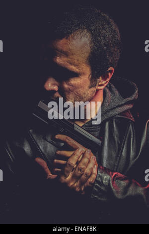 Robber with gun. Man in suit draws vintage handgun Stock Photo - Alamy