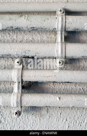 gas pipes painted white Stock Photo - Alamy
