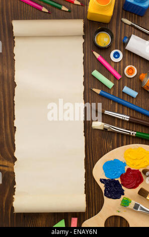 Blue notebook, pencil, glass of water and a bottle of water on wooden ...
