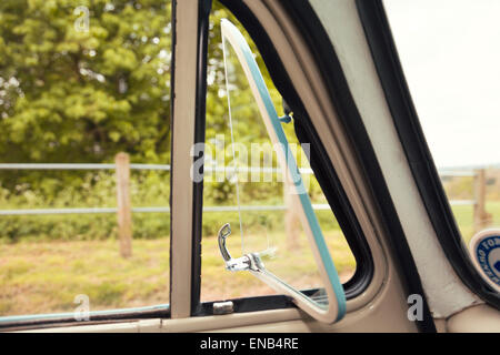 Ford 100E Escort Estate, Baby Blue in parkland with trees and a blue ...