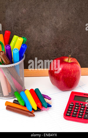 Doing homework with crayons and calculator Stock Photo - Alamy