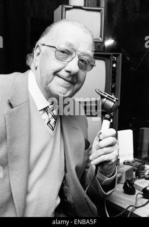 BBC snooker commentator Ted Lowe standing beside a television camera ...