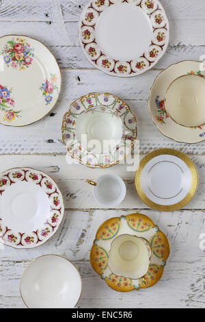 flower shape empty ceramic dishes stack up on a black background Stock ...