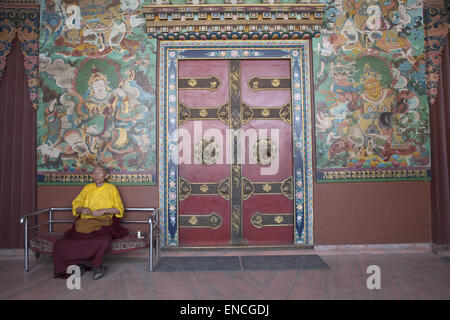 Nepal. 2nd May, 2015. A Holy man sets and prays in a temple at Buddha ...