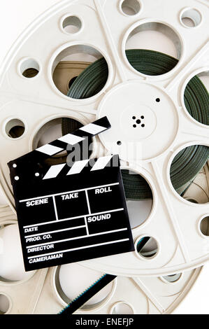 Two movie reels for 35 mm film projector with clapper board and ...