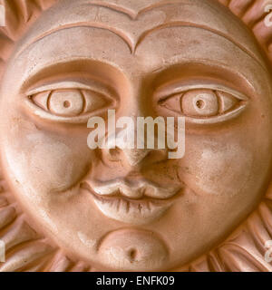 Terracotta sun face Stock Photo - Alamy