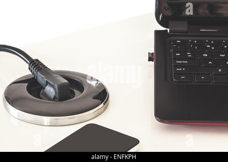 Details of an electric plug built in table Stock Photo - Alamy