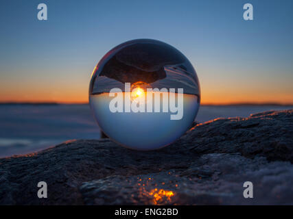 Close up of sunset horizon inverted in glass sphere Stock Photo - Alamy
