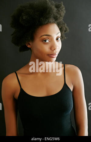 Young woman smirking at camera, portrait Stock Photo - Alamy