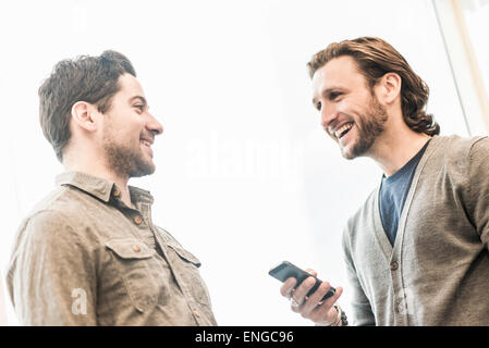 Two men smiling Stock Photo - Alamy