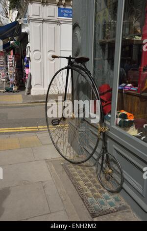 A historic image of a penny farthing bicycle from the past, showcasing ...