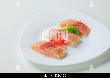 Raw fish skewer on a plate Stock Photo - Alamy