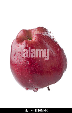Red apple with water drops on a wooden kitchen table Stock Photo - Alamy
