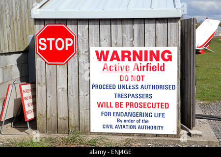 Red Airfield warning sign. Stop.. Active airfield. Authorised access ...