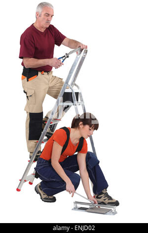 senior tiler working Stock Photo - Alamy