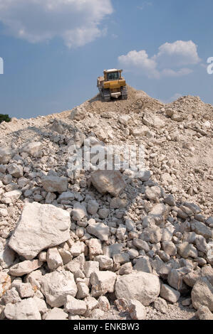 loading machine produces crushed stone for a career Stock Photo - Alamy