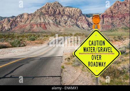 Warning sign, Flash Flood Area, danger of flash floods on a desert road ...
