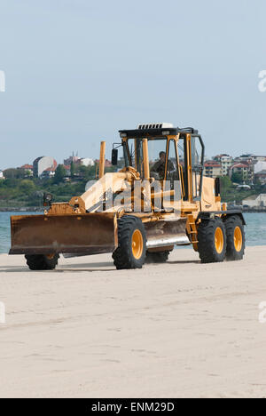 Grader on the beach Stock Photo - Alamy